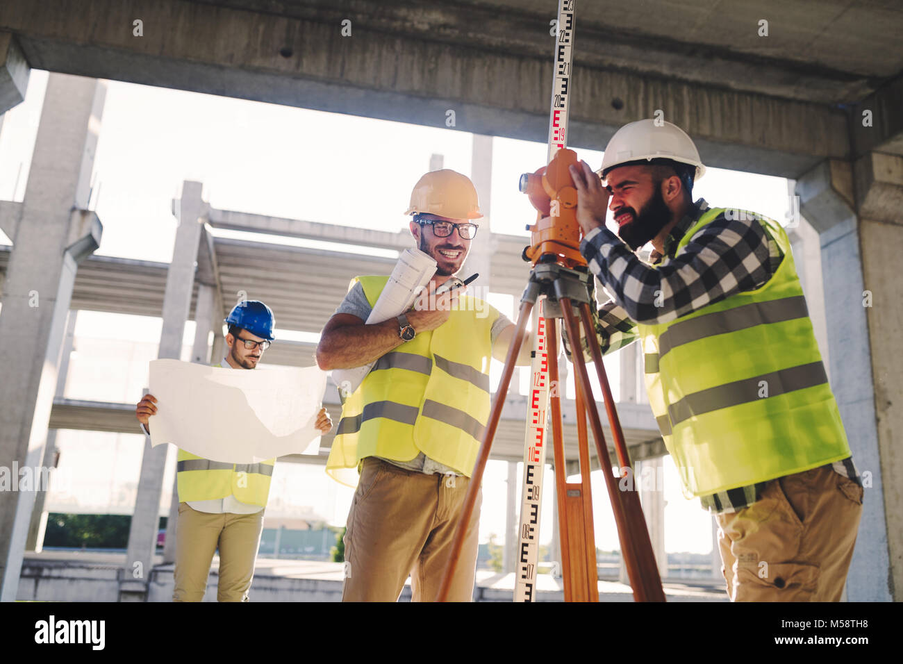 Portrait of construction engineers working on building site Stock Photo ...
