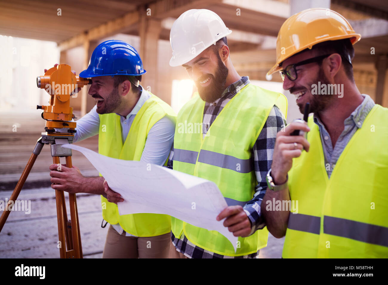 Portrait of construction engineers working on building site Stock Photo ...