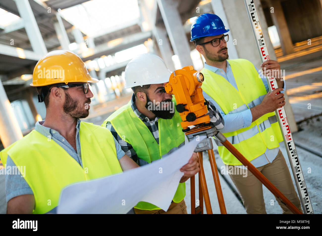 Portrait of construction engineers working on building site Stock Photo ...