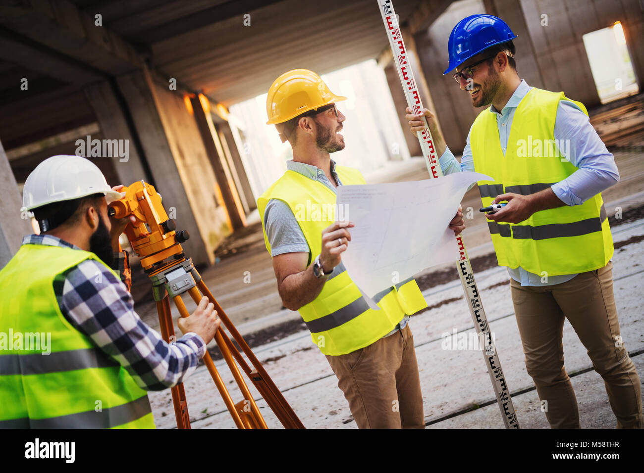 Portrait of construction engineers working on building site Stock Photo ...