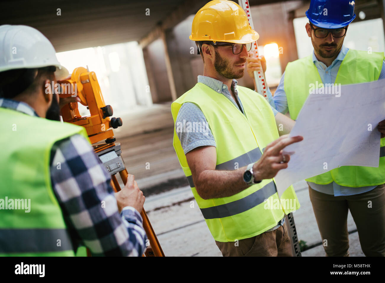Portrait of construction engineers working on building site Stock Photo ...