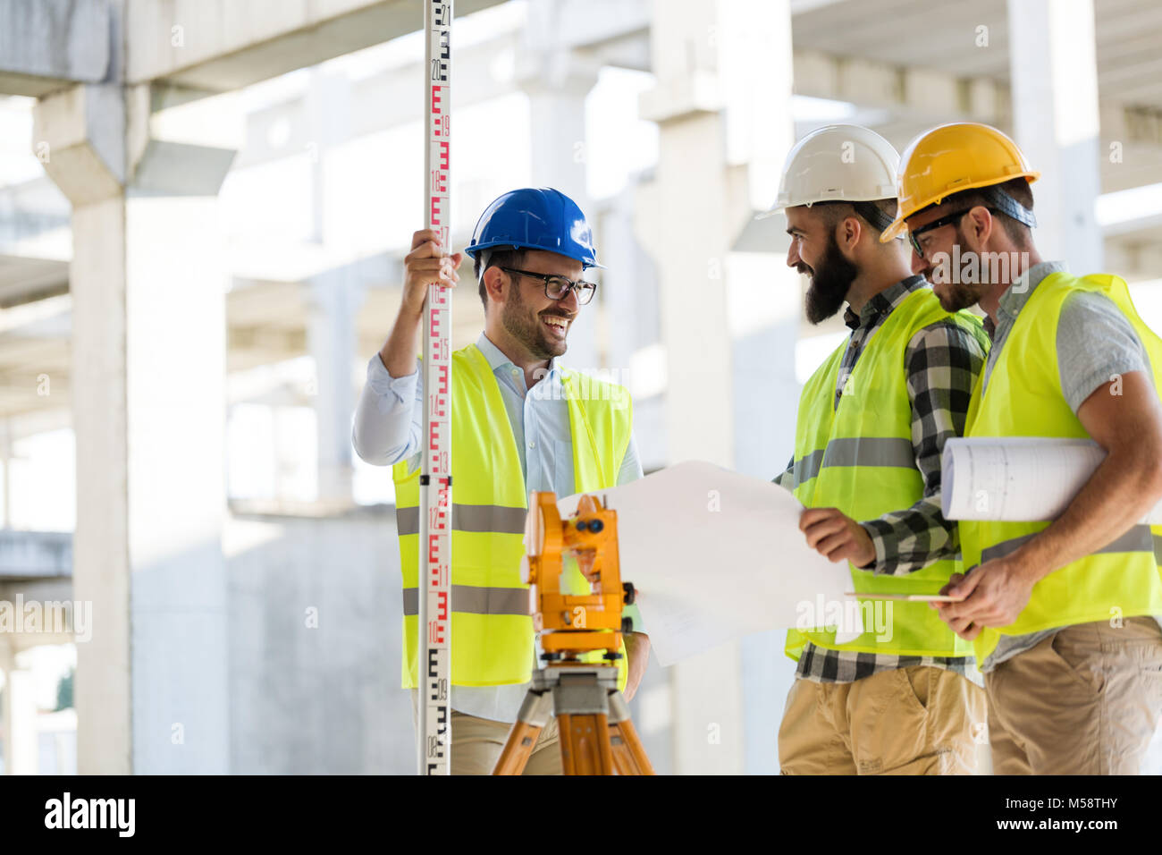 Portrait of construction engineers working on building site Stock Photo ...