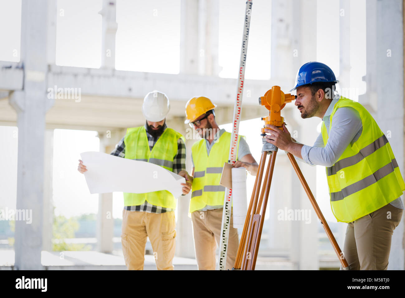 Portrait of construction engineers working on building site Stock Photo ...