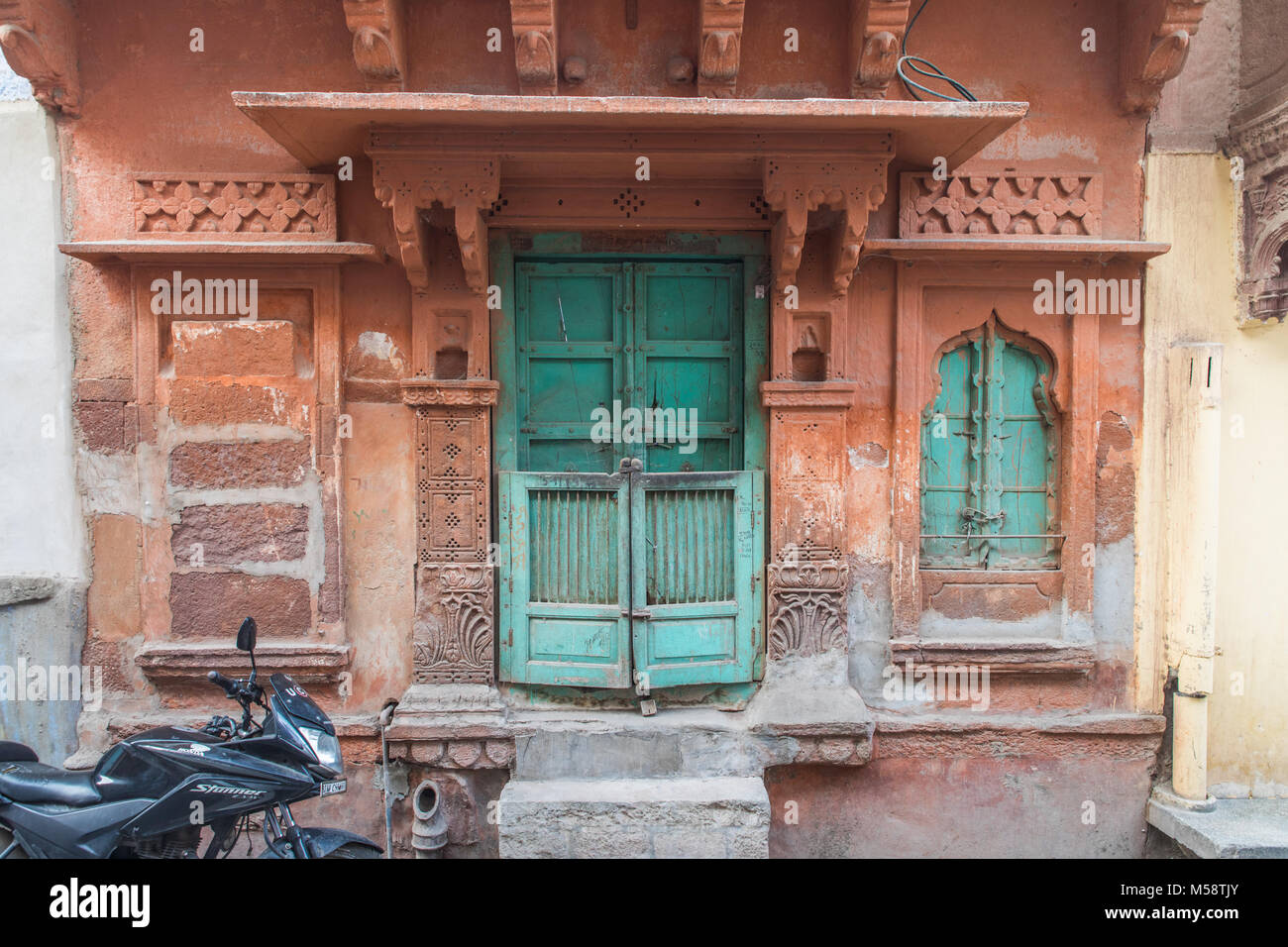An Old Haveli of Jodhpur, with a modern motorbike parked in front of ...