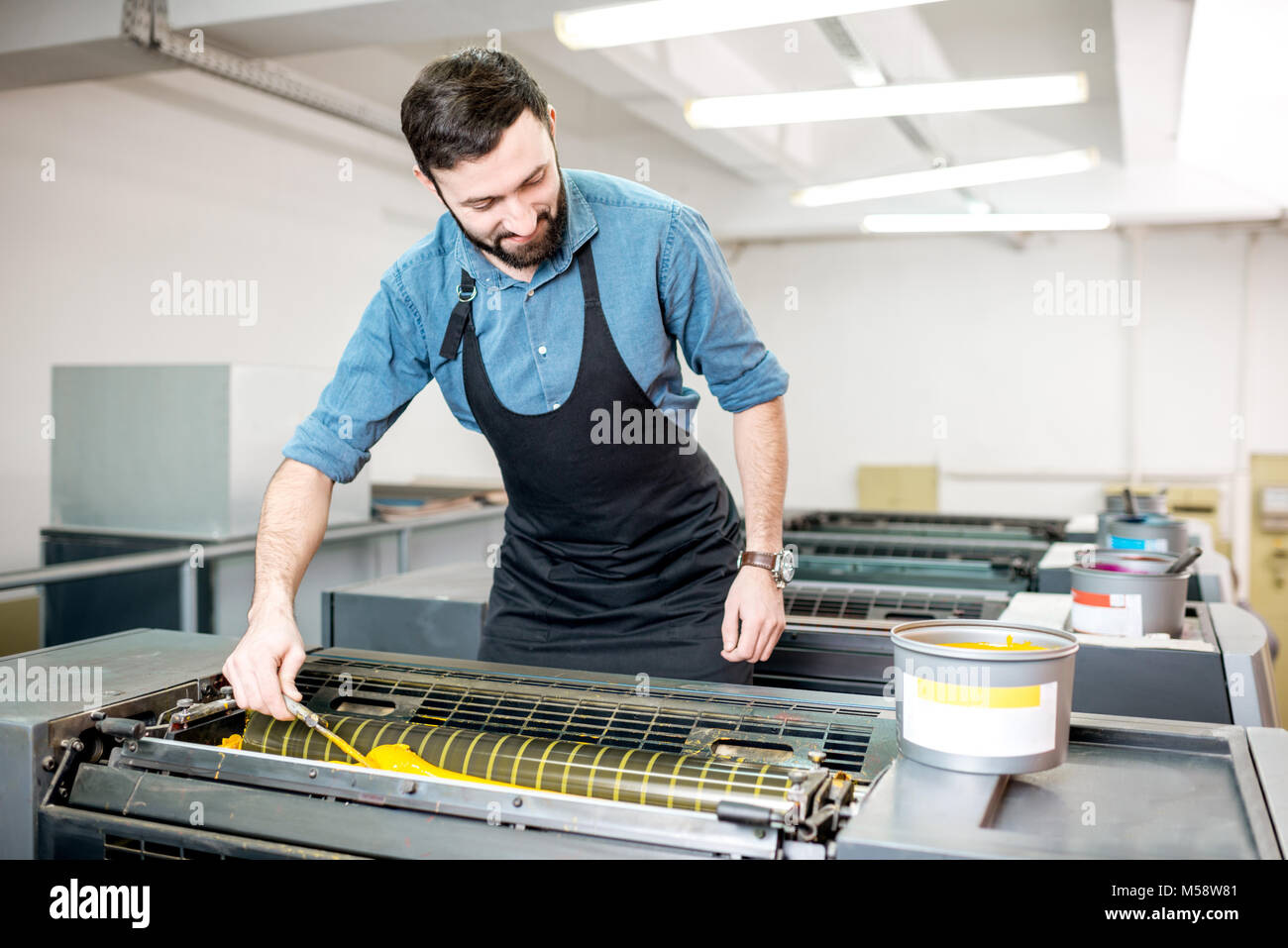 Typographer with paint at the manufacturing Stock Photo - Alamy