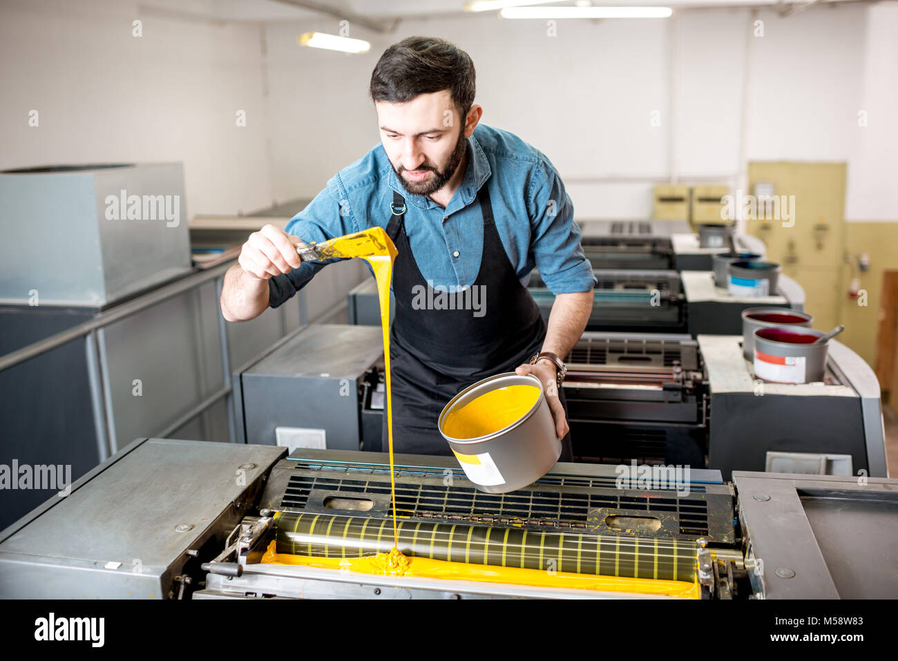Typographer with paint at the manufacturing Stock Photo - Alamy