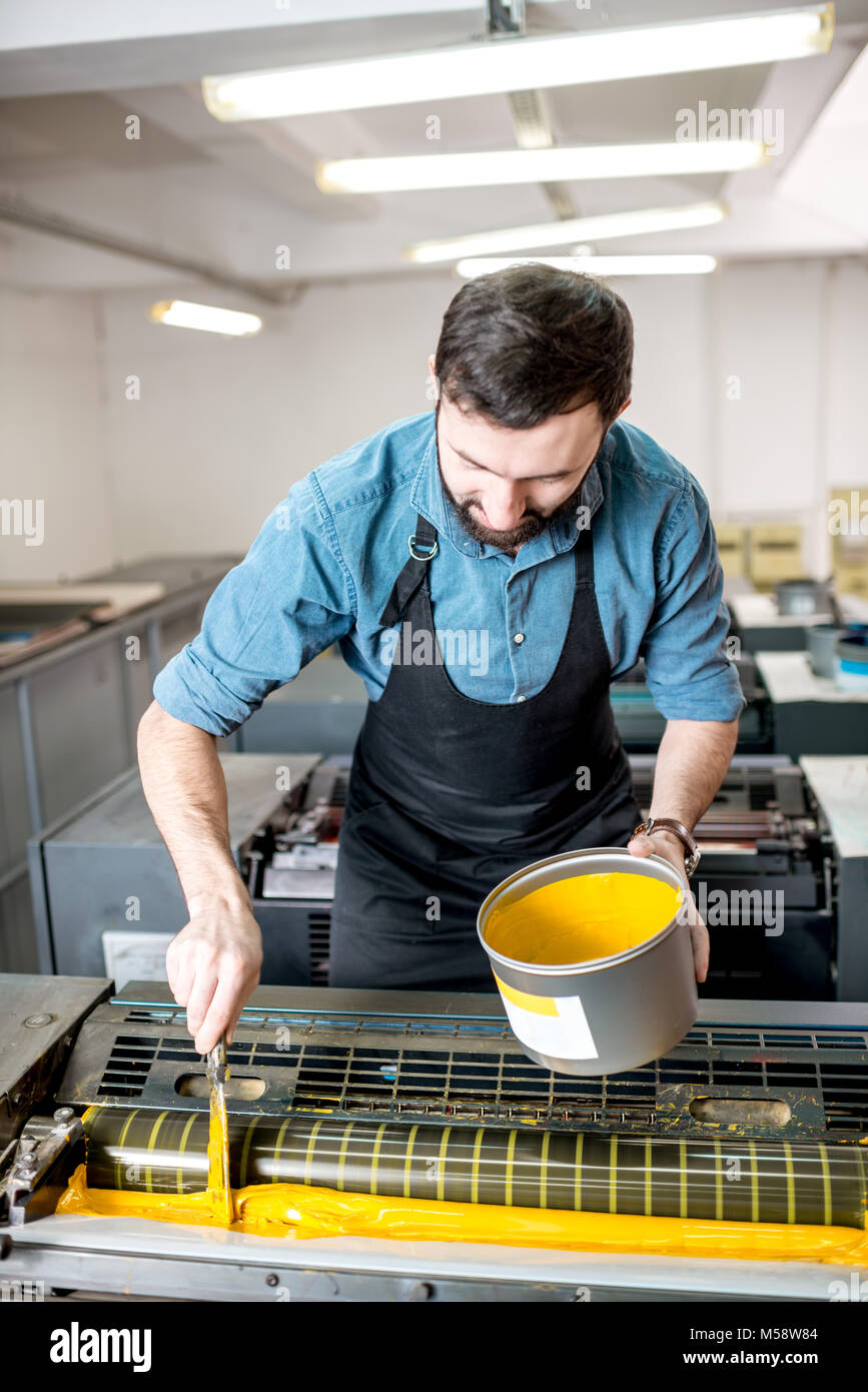 Typographer with paint at the manufacturing Stock Photo - Alamy