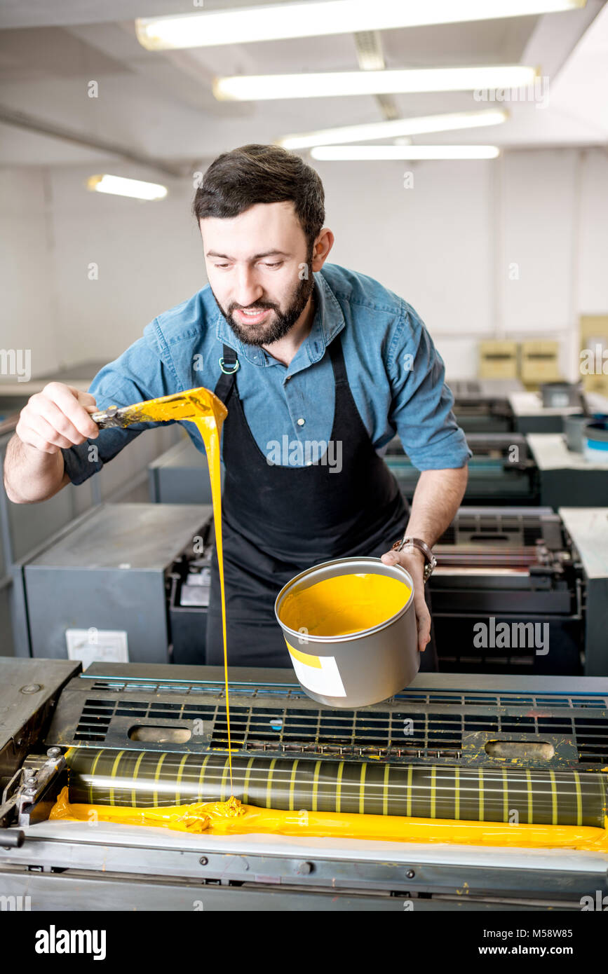 Typographer with paint at the manufacturing Stock Photo - Alamy
