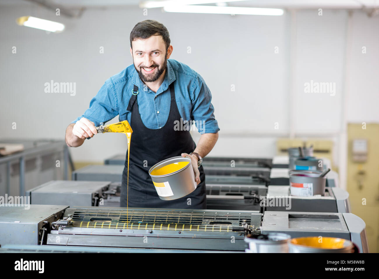 Typographer with paint at the manufacturing Stock Photo - Alamy