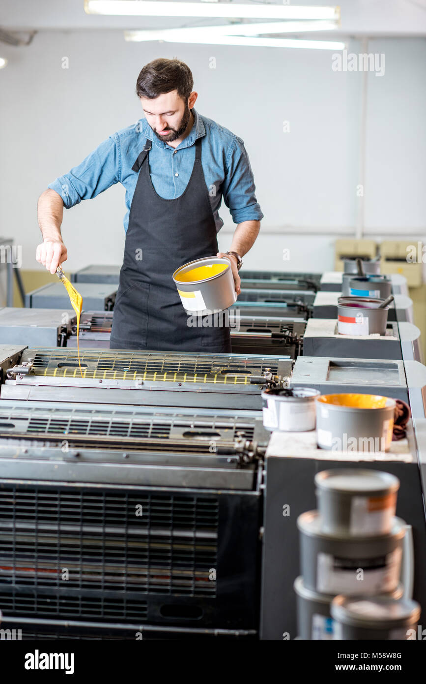 Typographer with paint at the manufacturing Stock Photo - Alamy