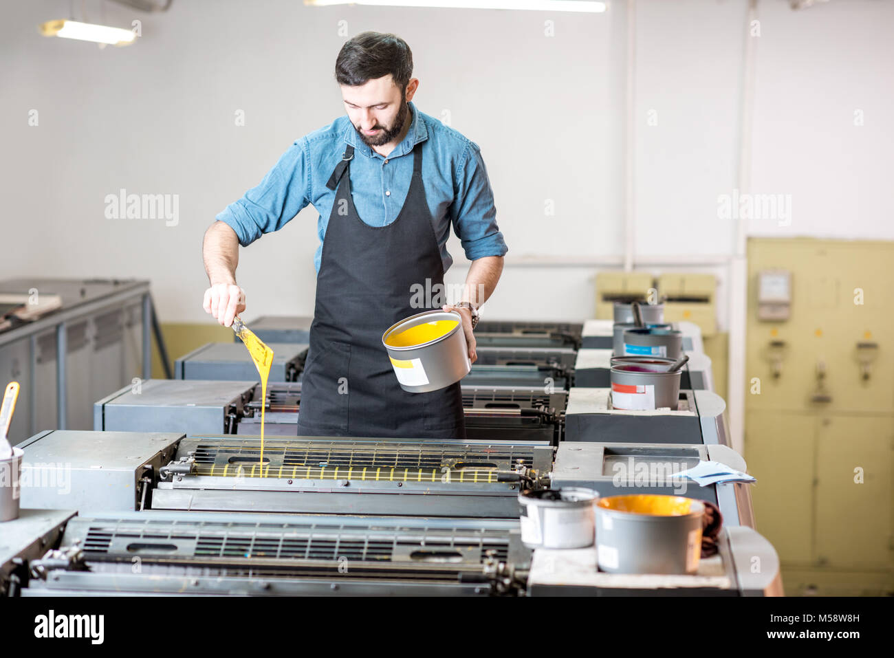 Typographer with paint at the manufacturing Stock Photo - Alamy