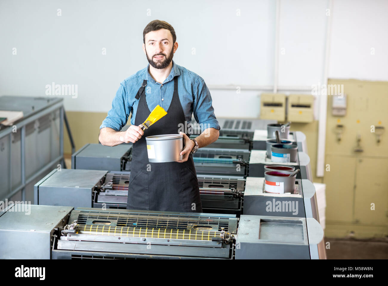 Typographer with paint at the manufacturing Stock Photo - Alamy