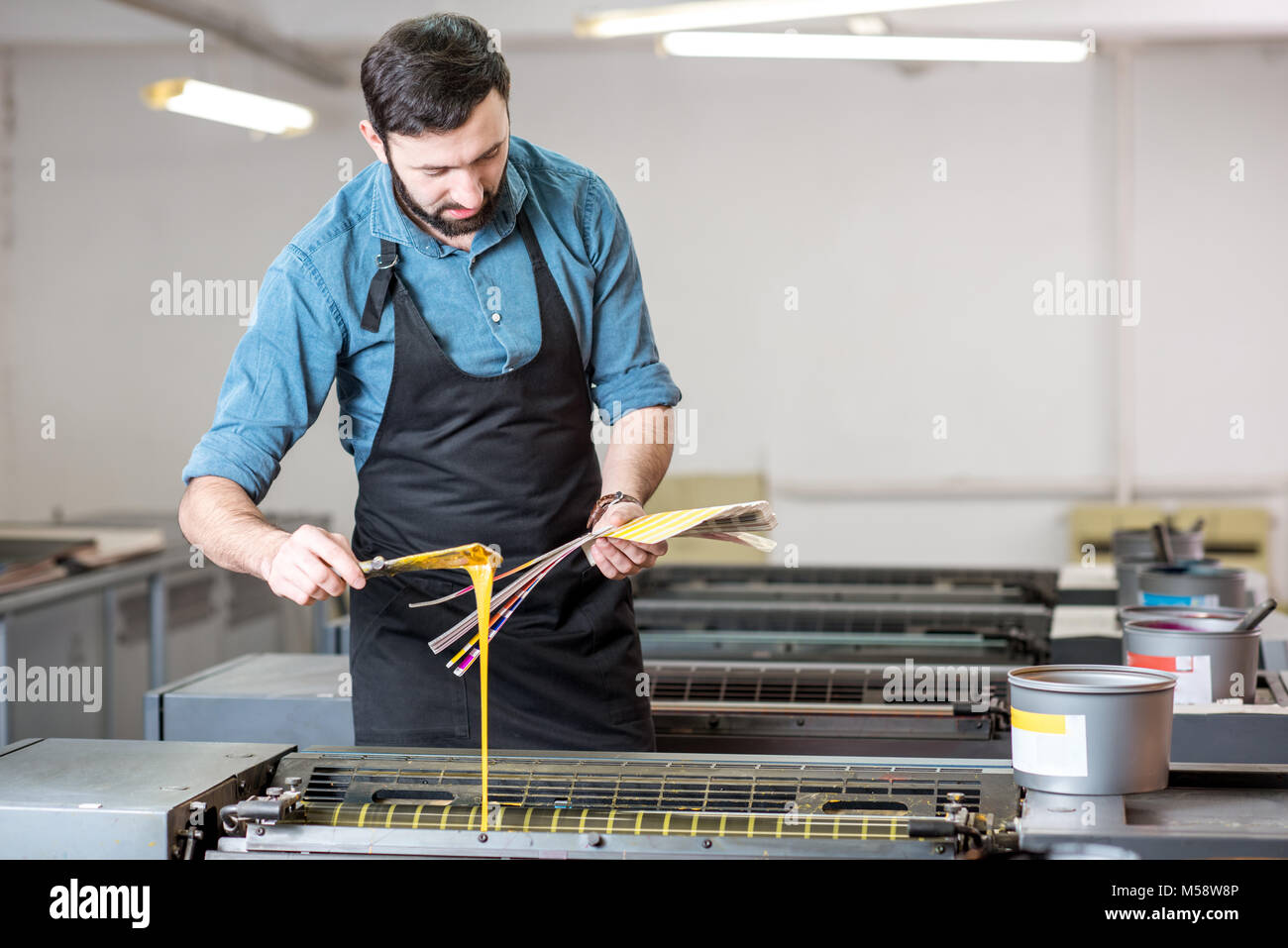 Typographer with paint at the manufacturing Stock Photo - Alamy