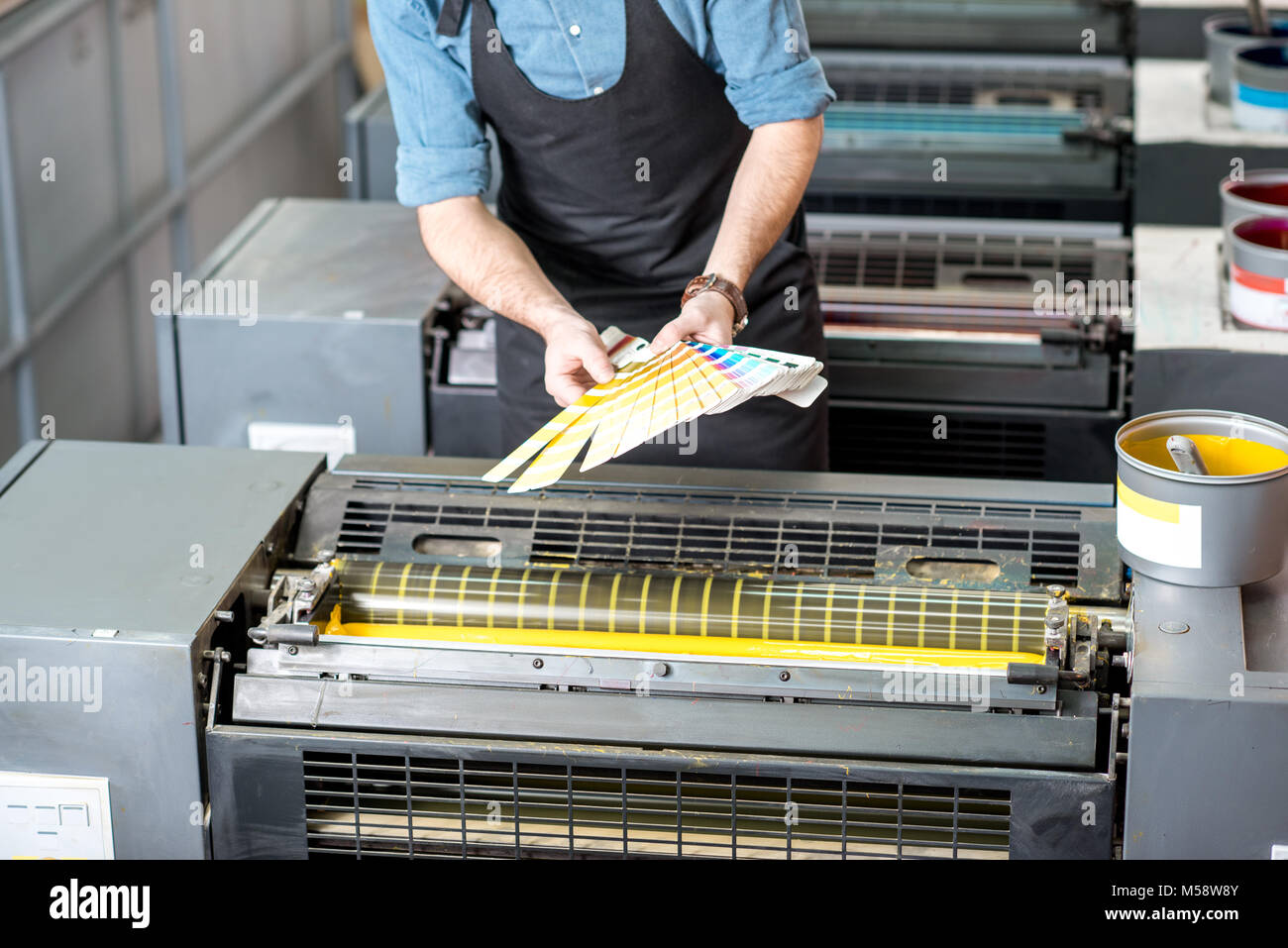 Choosing color at the printing manufacturing Stock Photo - Alamy