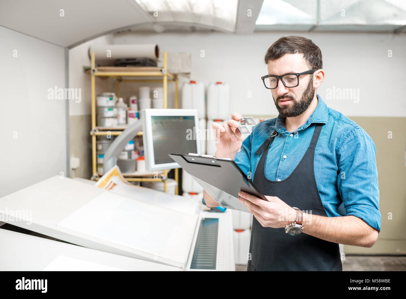 Typographer working at the printing plant Stock Photo - Alamy