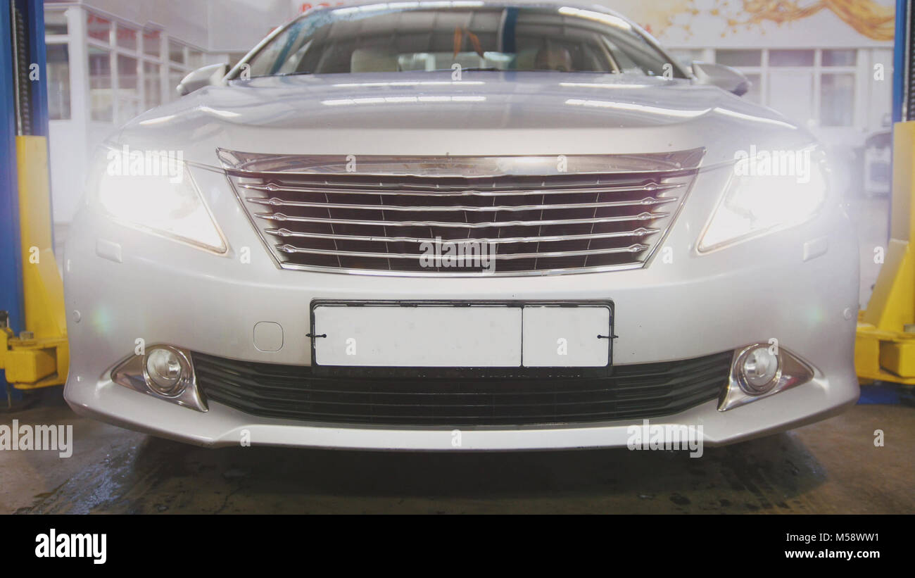 Auto service - checking headlights of car Stock Photo - Alamy