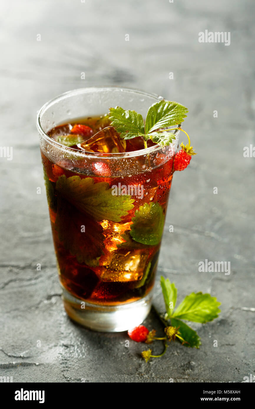 Refreshing iced tea with wild strawberry Stock Photo - Alamy