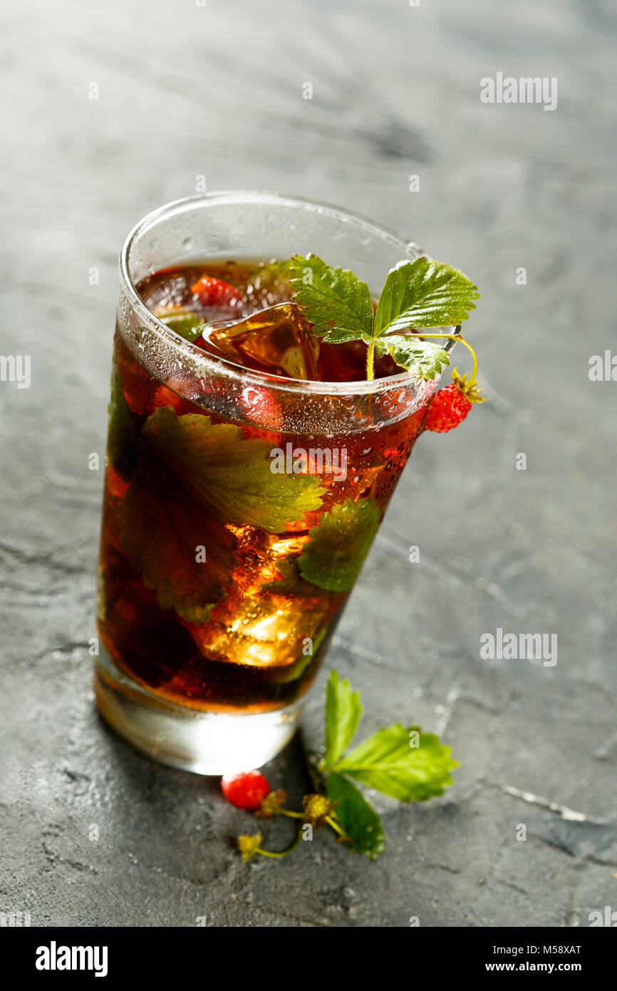 Refreshing iced tea with wild strawberry Stock Photo - Alamy