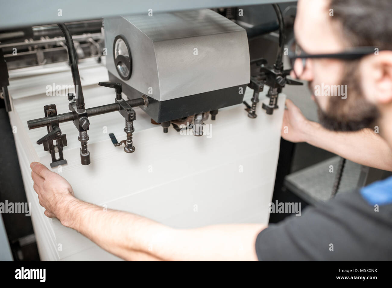 Filling up a paper into the printing machine Stock Photo - Alamy