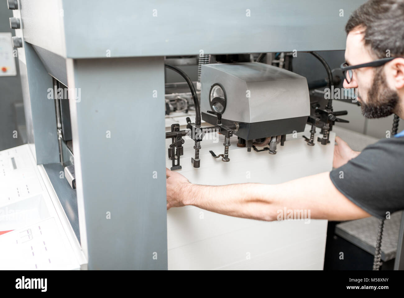 Filling up a paper into the printing machine Stock Photo - Alamy