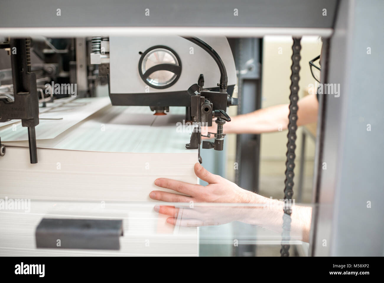 Filling up a paper into the printing machine Stock Photo - Alamy