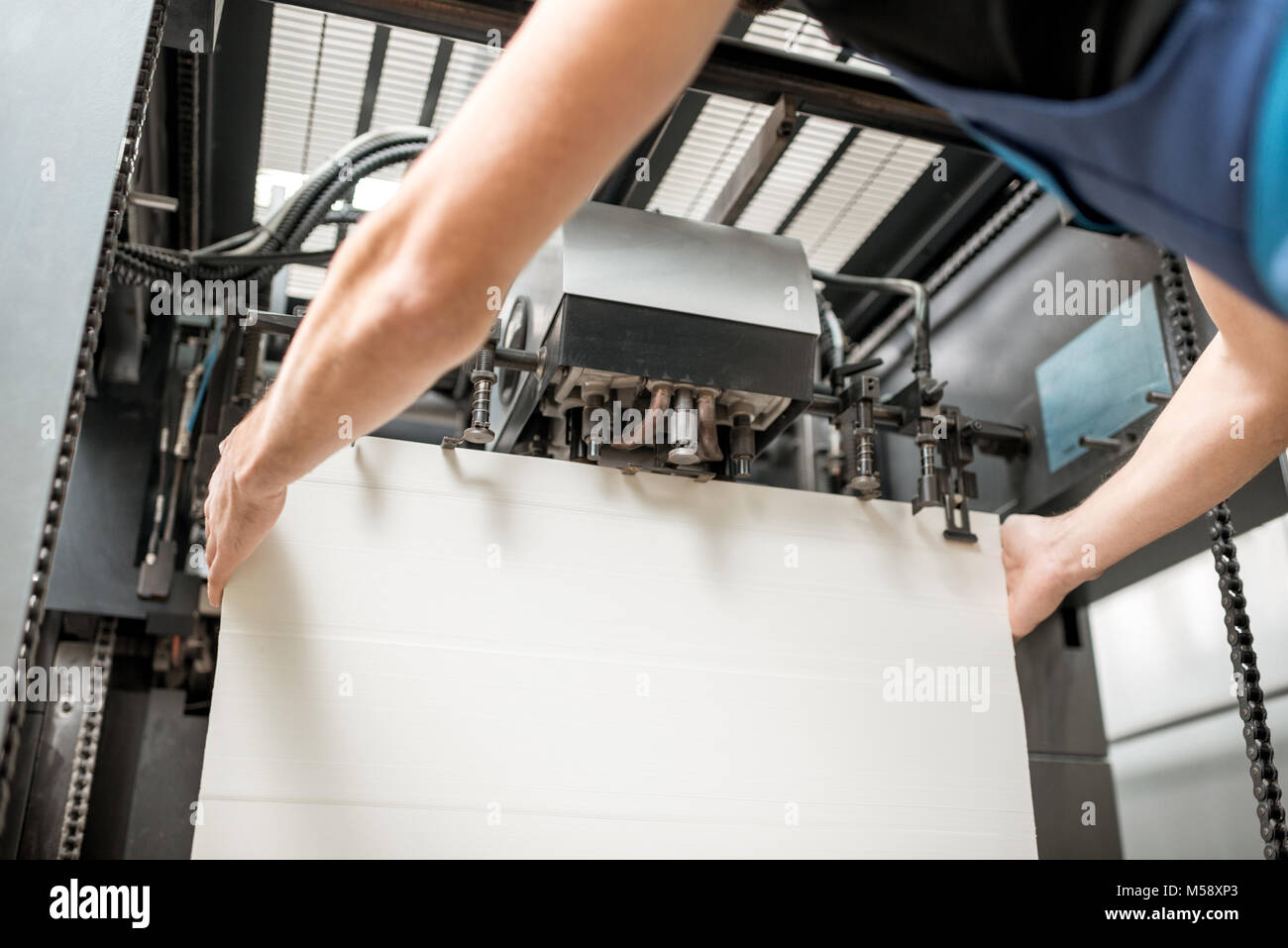 Filling up a paper into the printing machine Stock Photo - Alamy