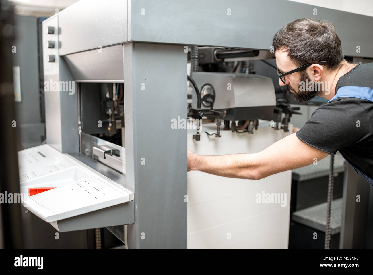 Filling up a paper into the printing machine Stock Photo - Alamy