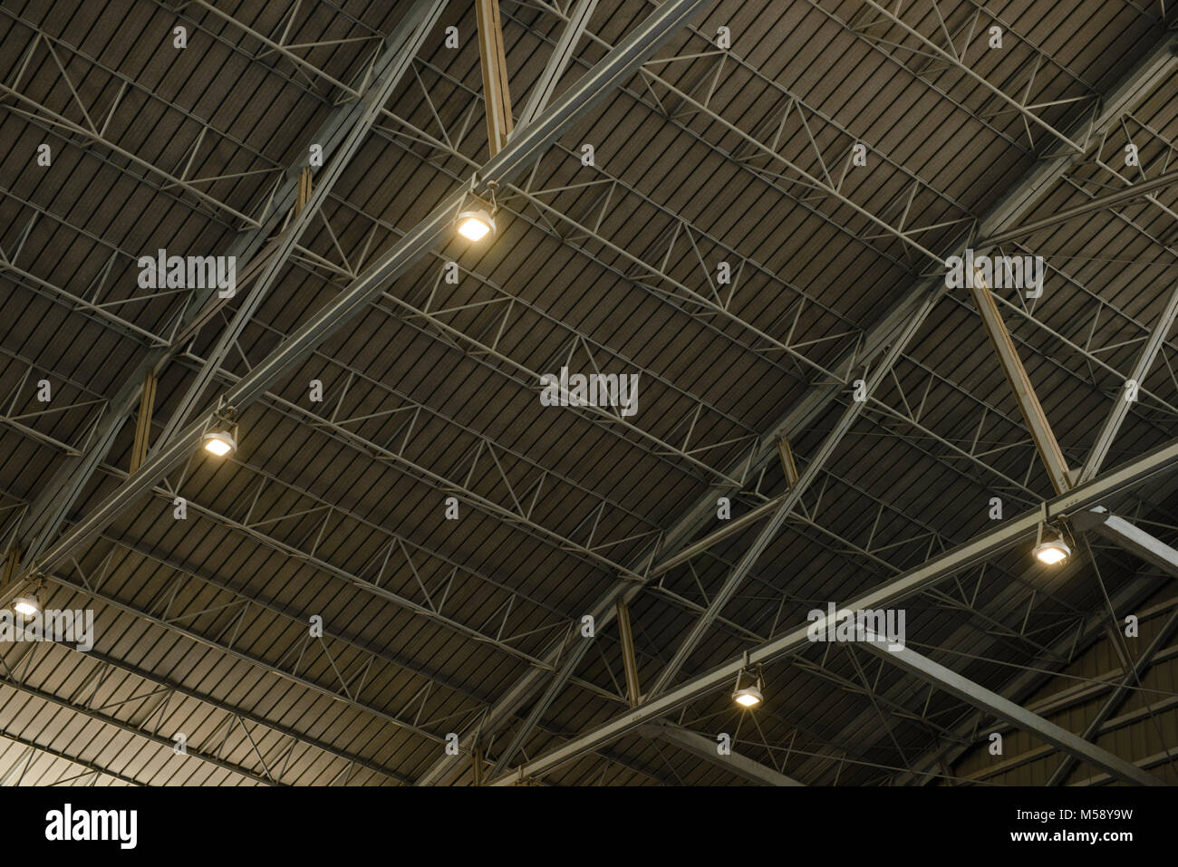 Detail of the structure of a warehouse roof with lamp Stock Photo - Alamy