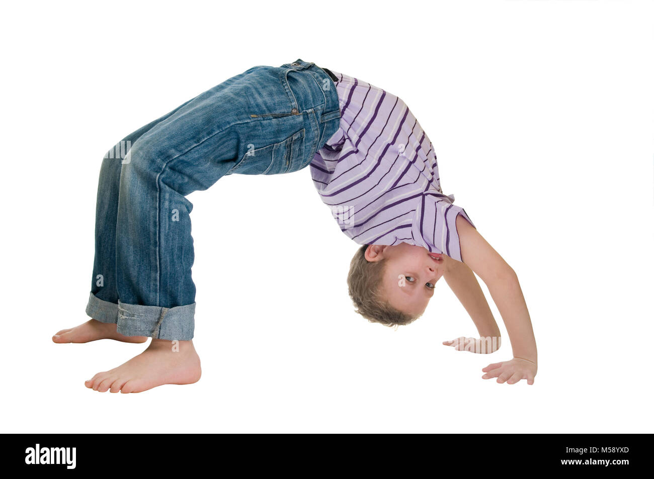 Side view of the full body one seven-year boys in white light in the ...