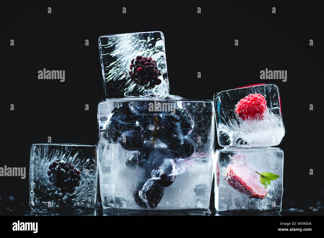 frozen fruits in ice cubes Stock Photo - Alamy