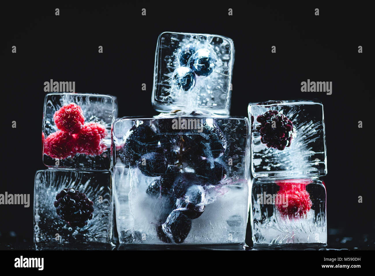 frozen fruits in ice cubes Stock Photo - Alamy