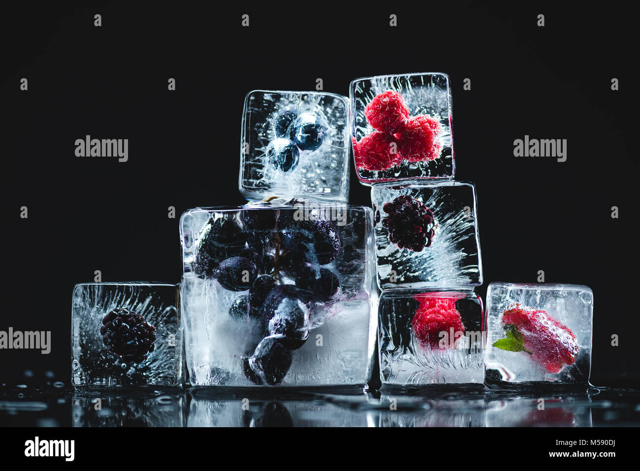 frozen fruits in ice cubes Stock Photo - Alamy