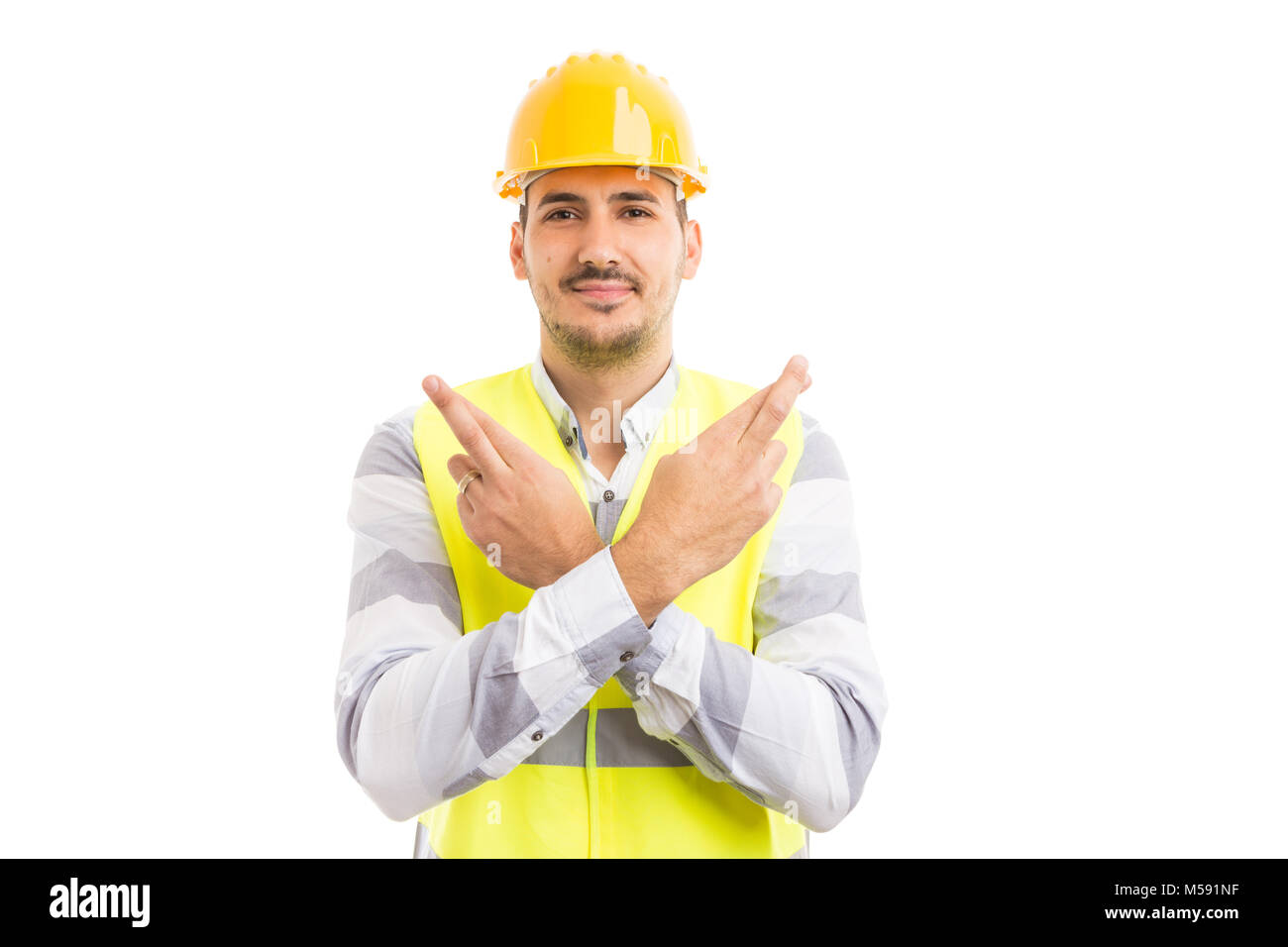 Construction builder making good luck gesture with fingers crossed on ...