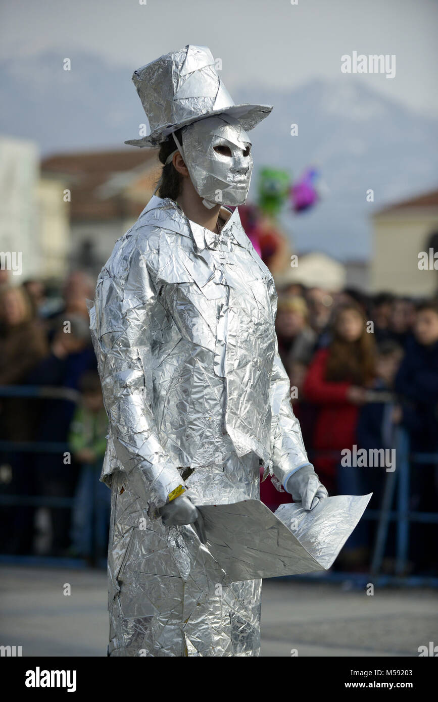 unrecognizable man wrapped with aluminium foil, holding book Stock ...