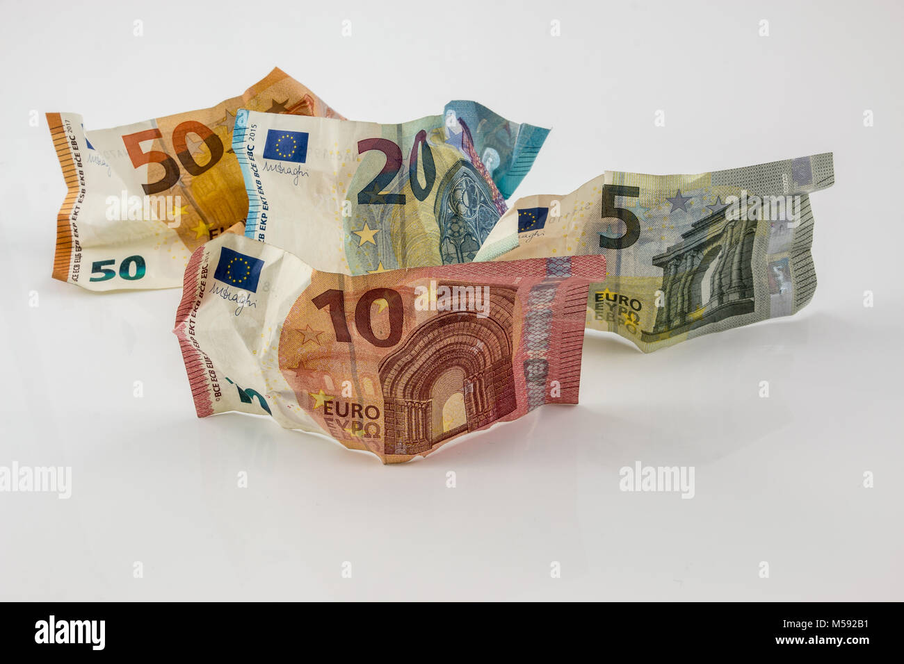 Euro banknotes and white background Stock Photo - Alamy