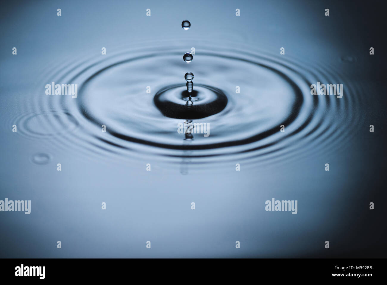 Splash on water surface Stock Photo - Alamy