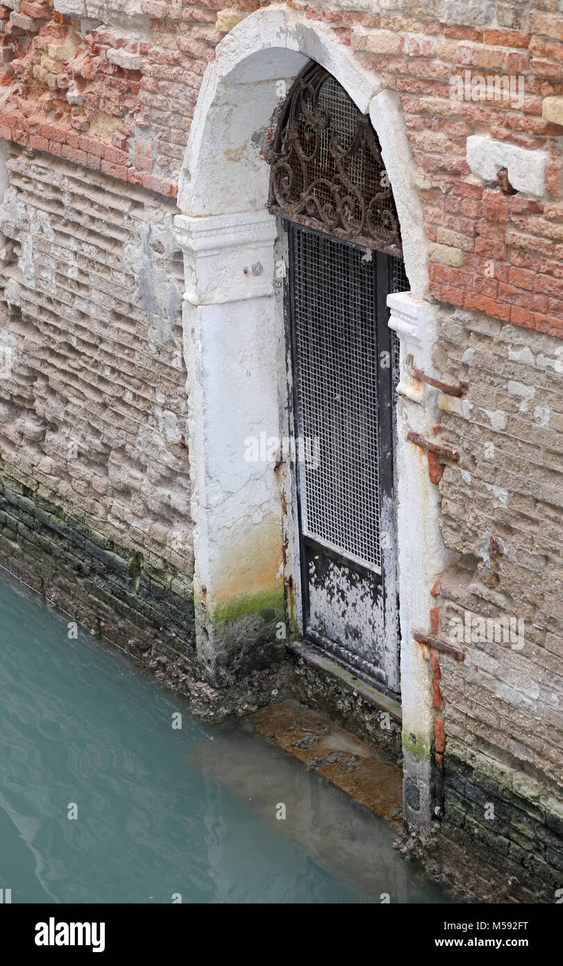 Old Venetian Gate with low tide in Venice Italy in winter Stock Photo ...