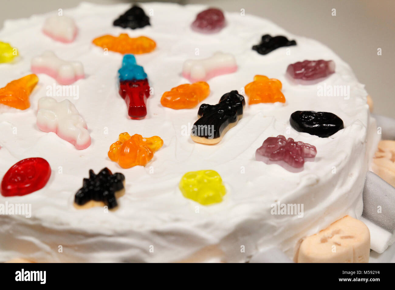 Cake covered with very good gummy candies Stock Photo - Alamy