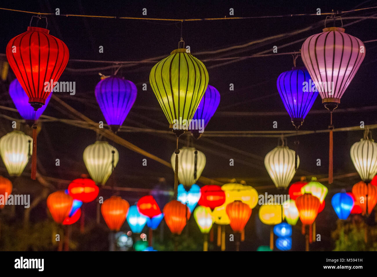 Paper lanterns lighted up on the streets of Hoi An ,Vietnam Stock Photo ...