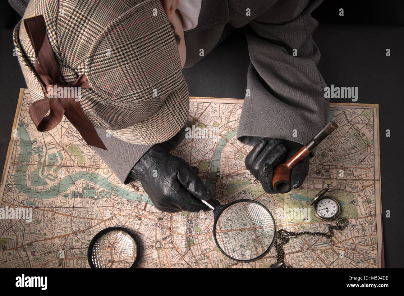 Detective man- magnifying glass, map of London, clock on chain Stock ...