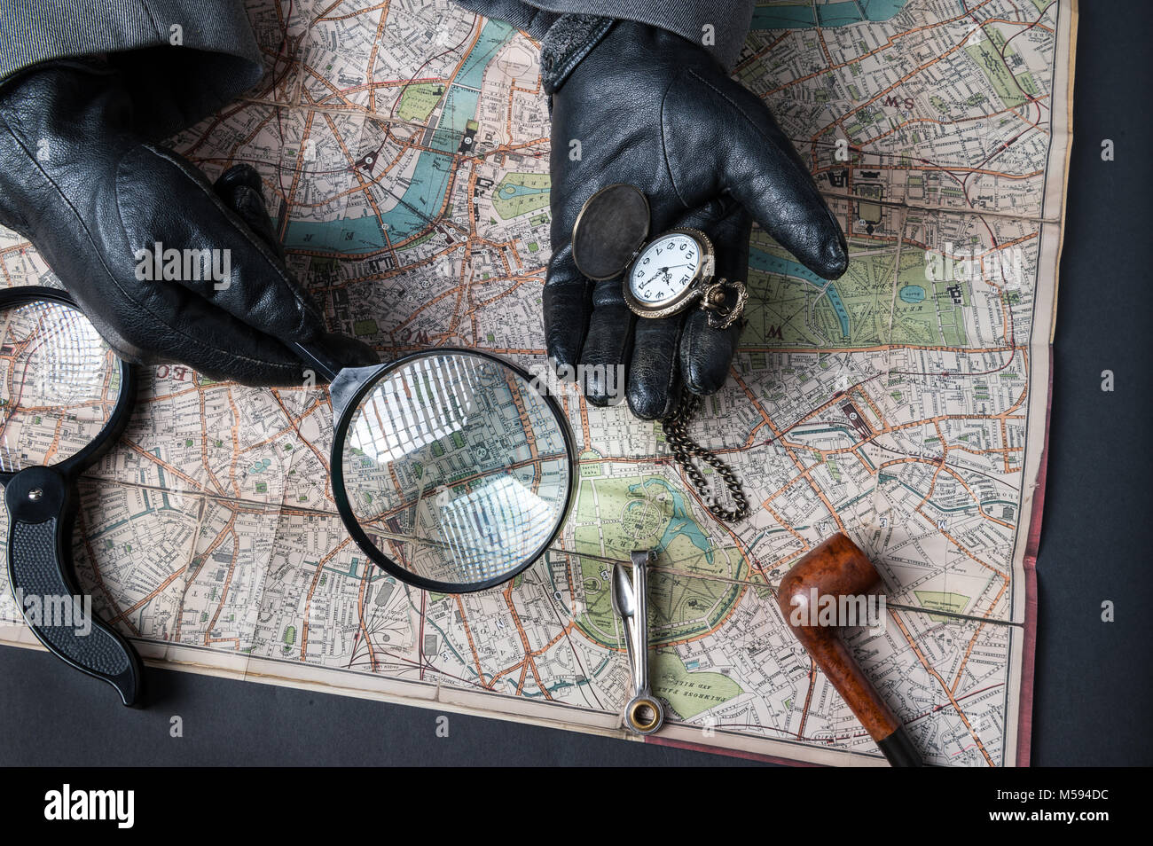 Detective man- magnifying glass, map of London, clock on chain Stock ...