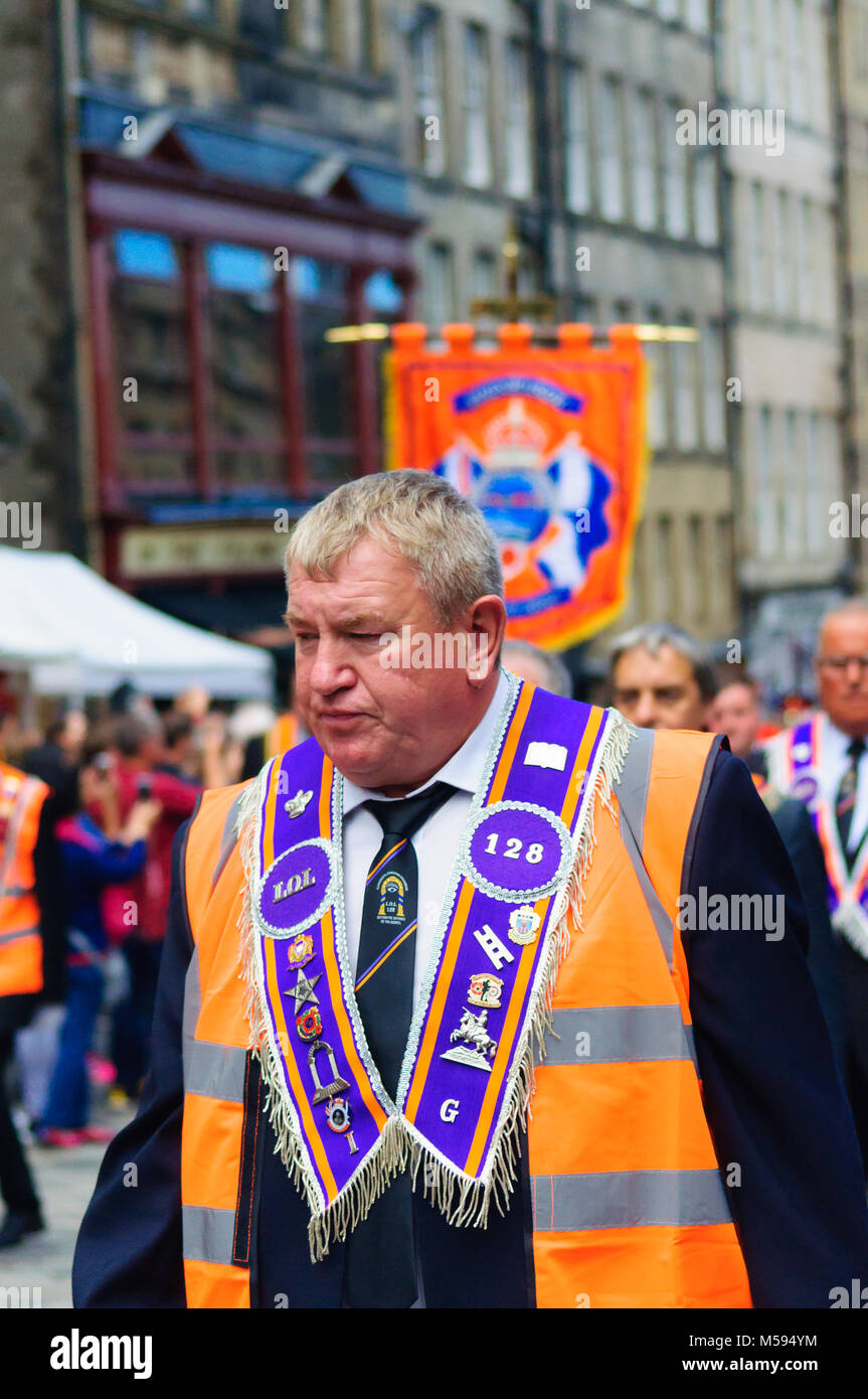 Male member of The Orange Order during the procession up the Royal Mile ...