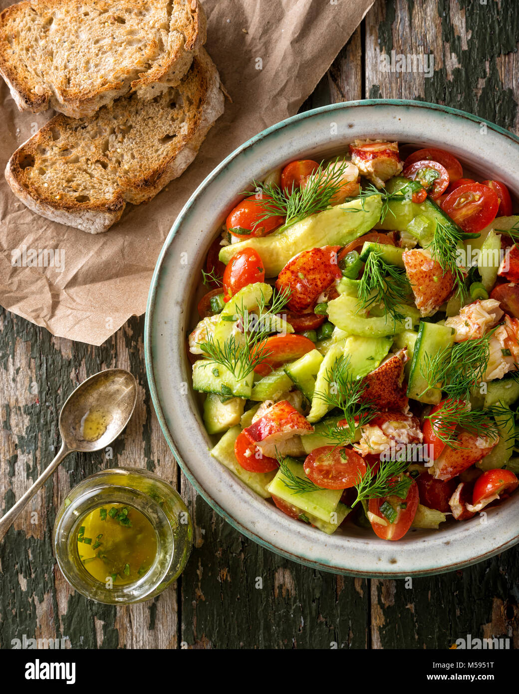 A delicious lobster and avocado salad with tomato, celery, cucumber ...