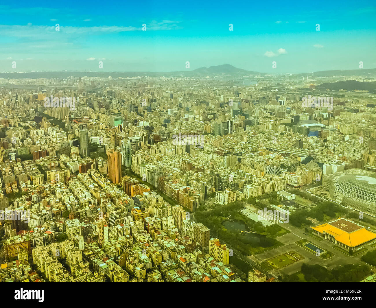 Aerial panorama over Taipei, capital City of Taiwan, on a blue sky and ...