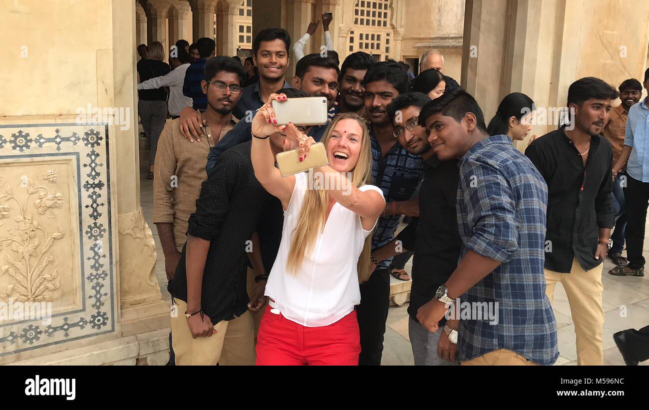 Girl taking a selfie with fans Stock Photo - Alamy