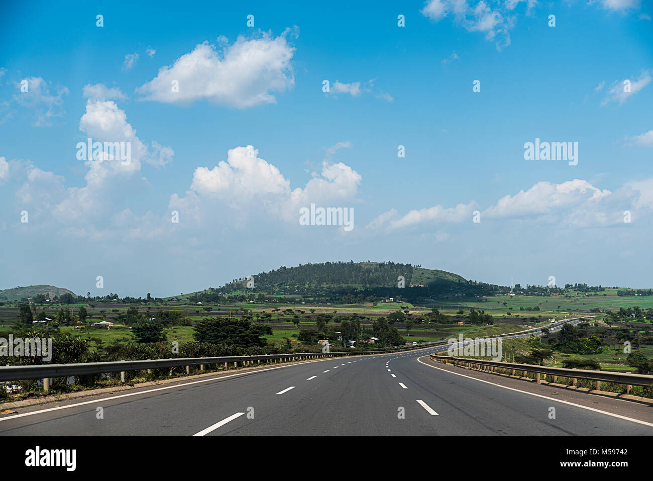 Addis Ababa Highway surrounded by green trees and mountains - Ethiopia ...