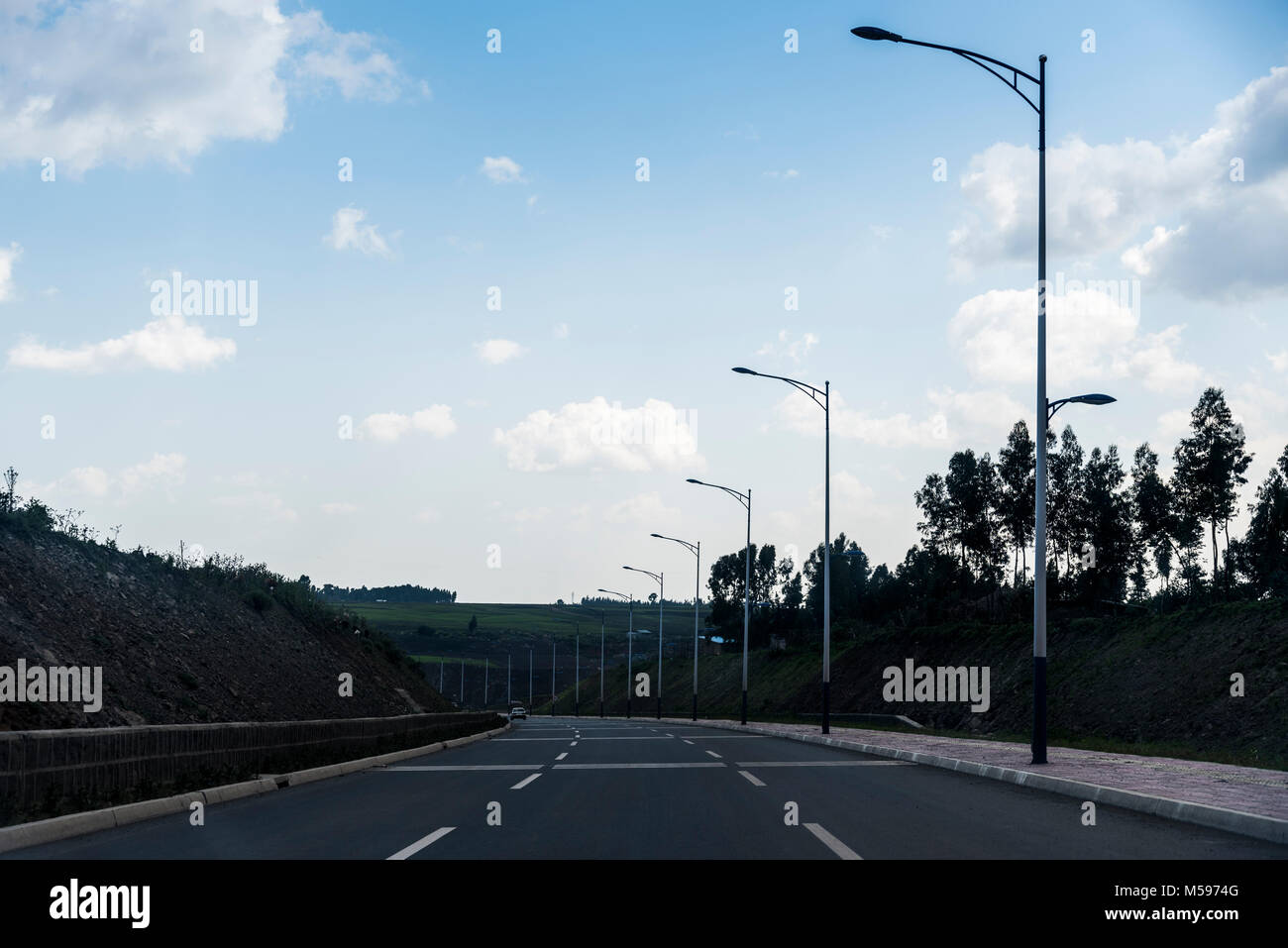 Addis Ababa Highway surrounded by green trees and mountains - Ethiopia ...