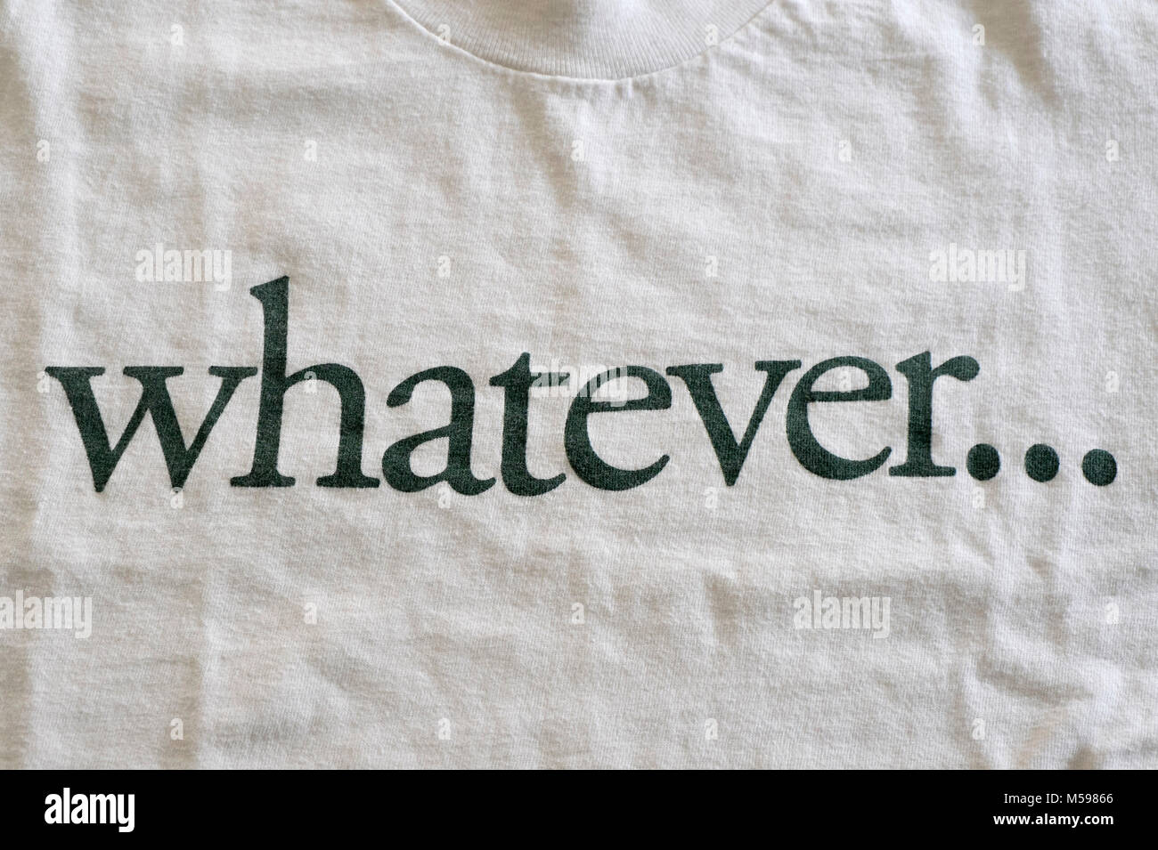The word Whatever in green type on a white t-shirt Stock Photo - Alamy