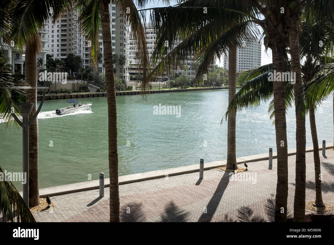 Boat cruising along the waterfront in downtown Brickell, Miami, Florida ...