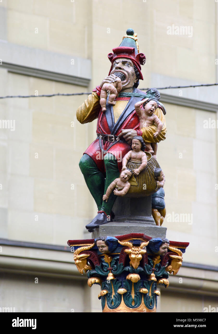 A fountain topped by a sculpture of an ogre eating children in Bern ...
